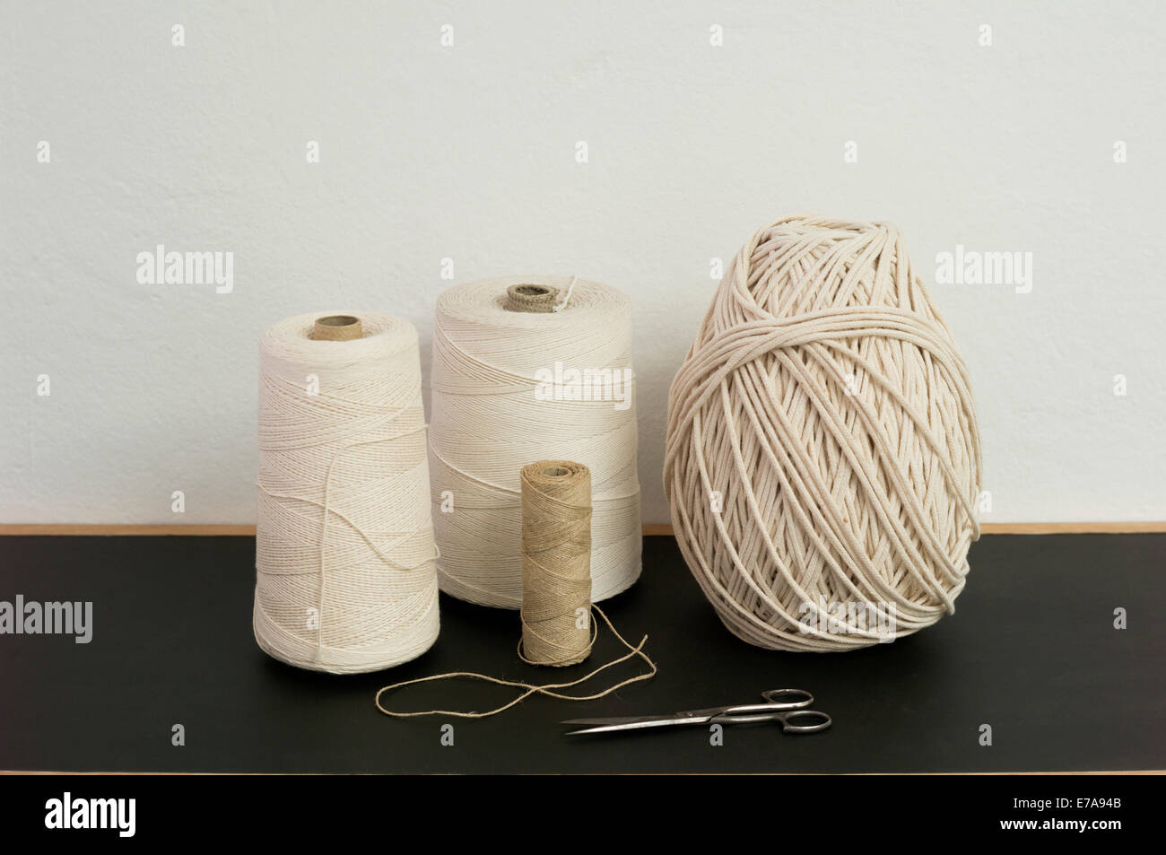 Variety of thread spools on table at home Stock Photo - Alamy