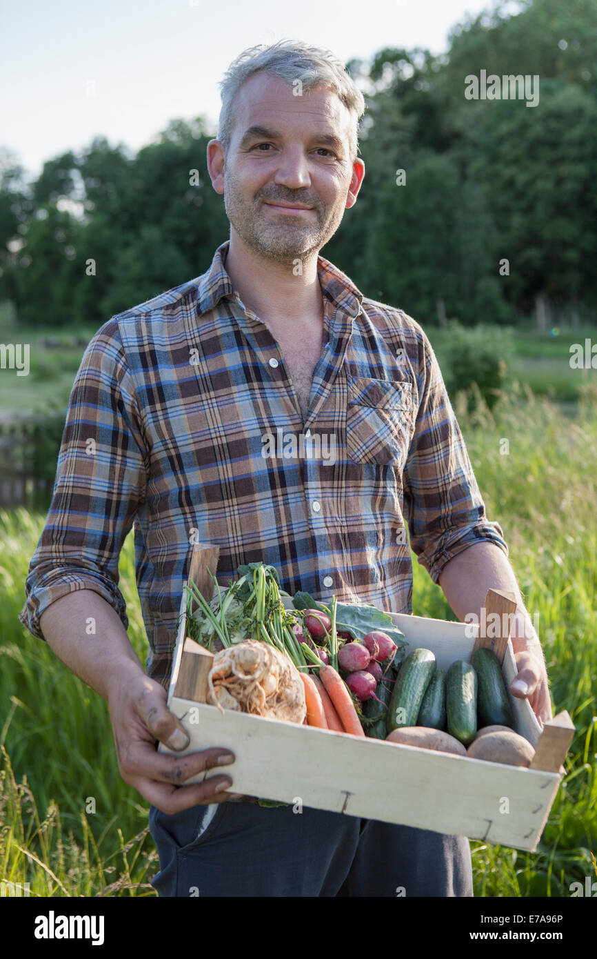 Portrait confident man carrying crate hi-res stock photography and ...