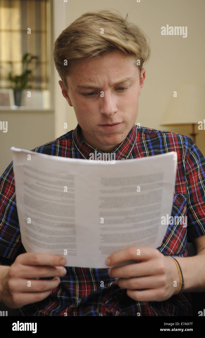Teenage Boy Reading At Home Stock Photo - Alamy