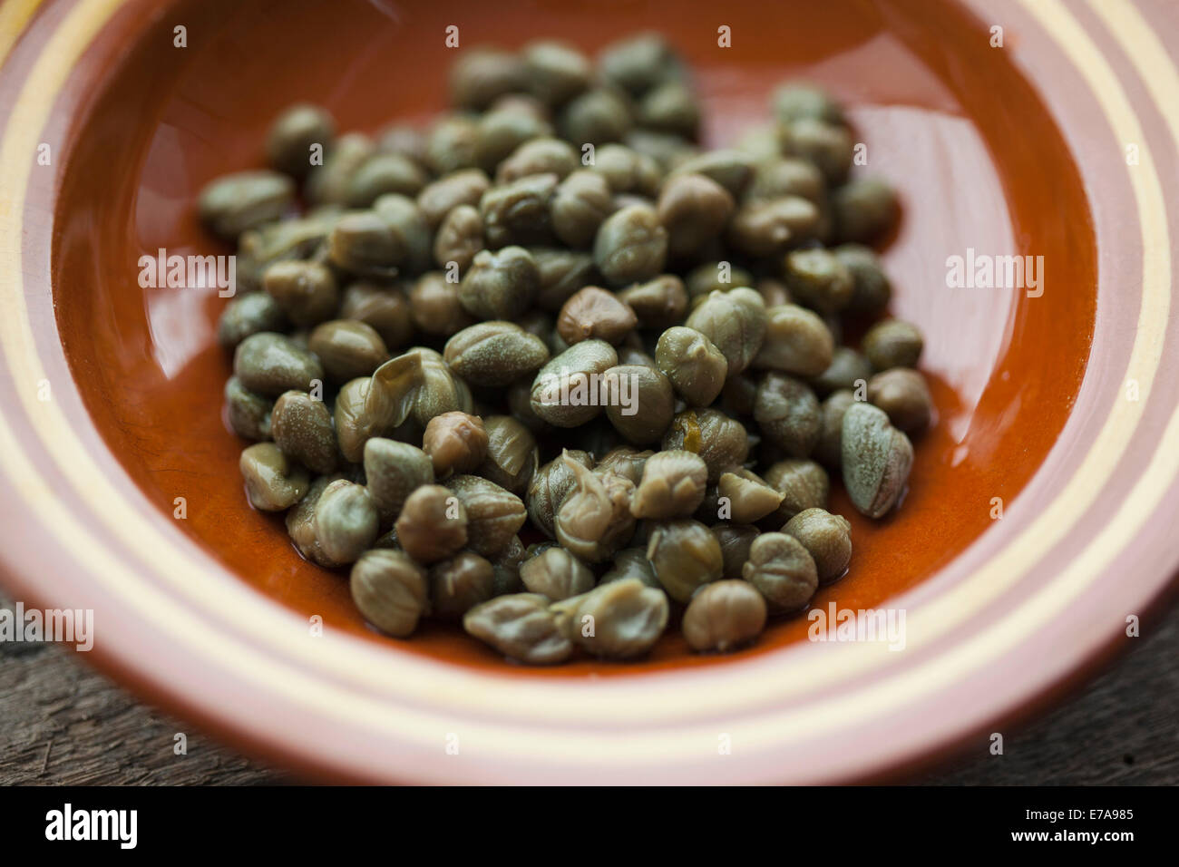 Bowl of capers Stock Photo - Alamy