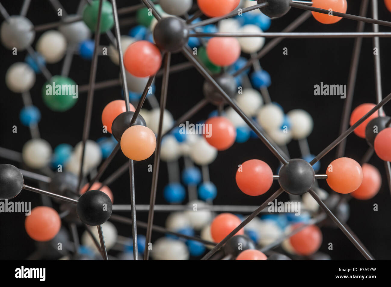 Close-up of multi colored molecular structure over white background ...