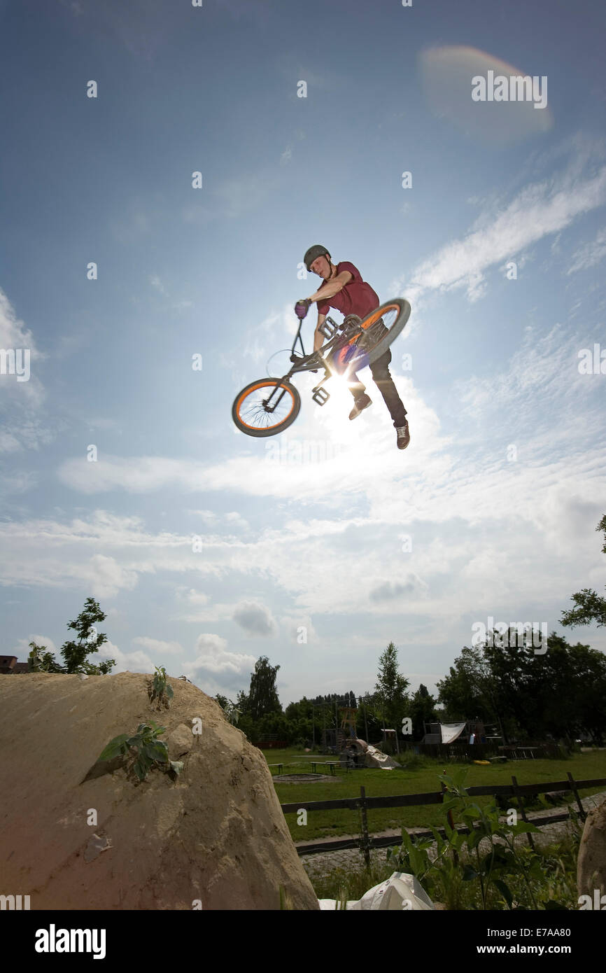 A BMX rider doing a stunt in mid-air Stock Photo - Alamy
