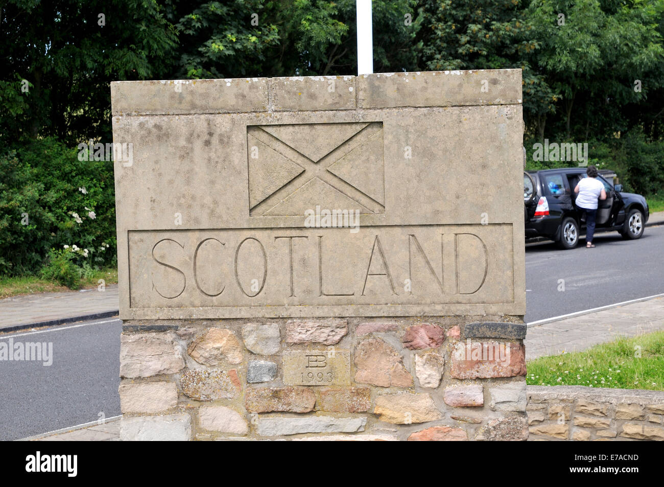 A stone sign reading "Scotland" is posted on the A1 at the English ...