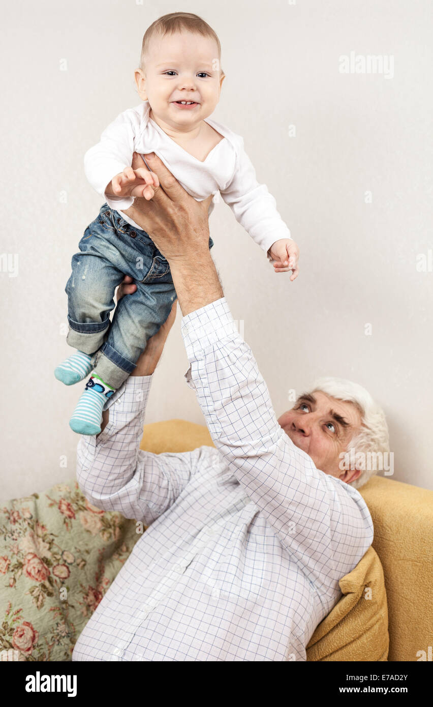 Grandfather grandparent holding baby boy hi-res stock photography and ...