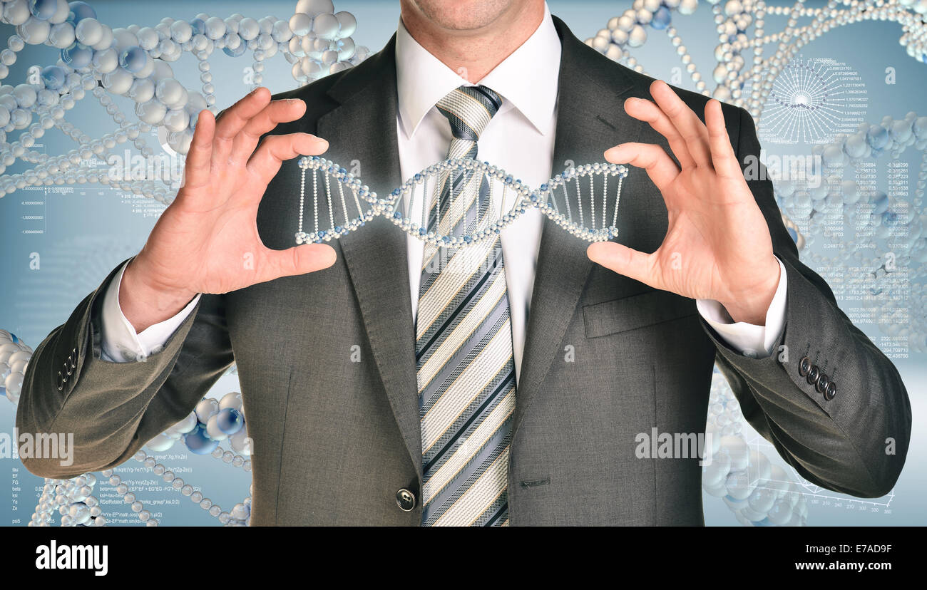 Businessman holding dna spiral in hands Stock Photo - Alamy