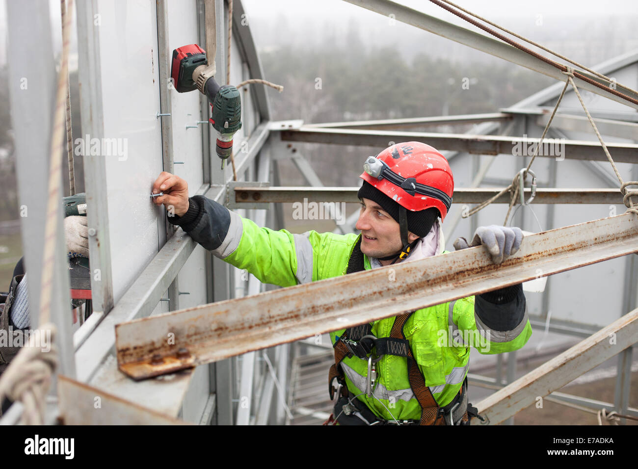 Industrial climber on top of a metal construction Stock Photo - Alamy