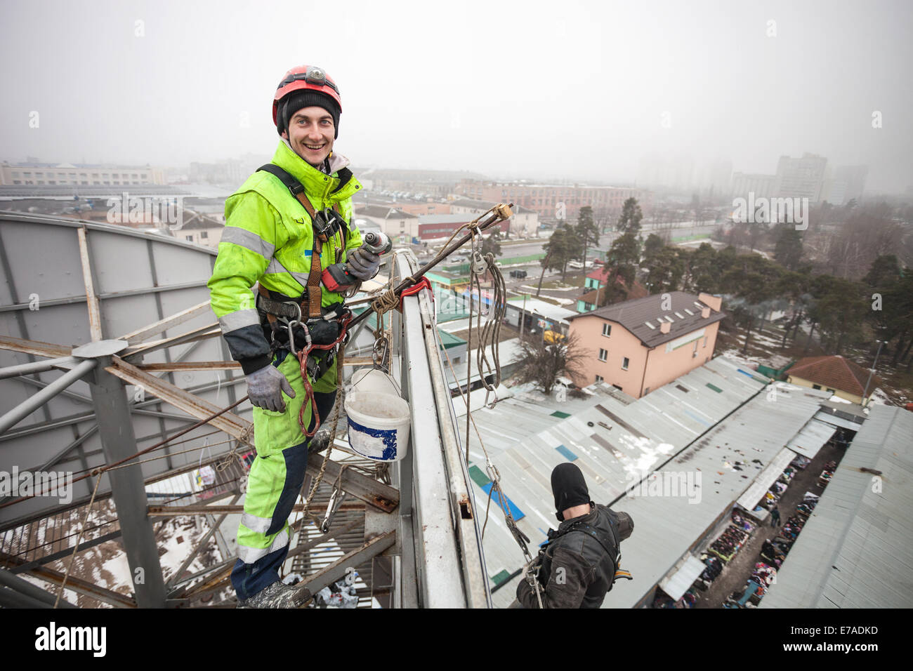 Industrial climber on top of a metal construction Stock Photo - Alamy