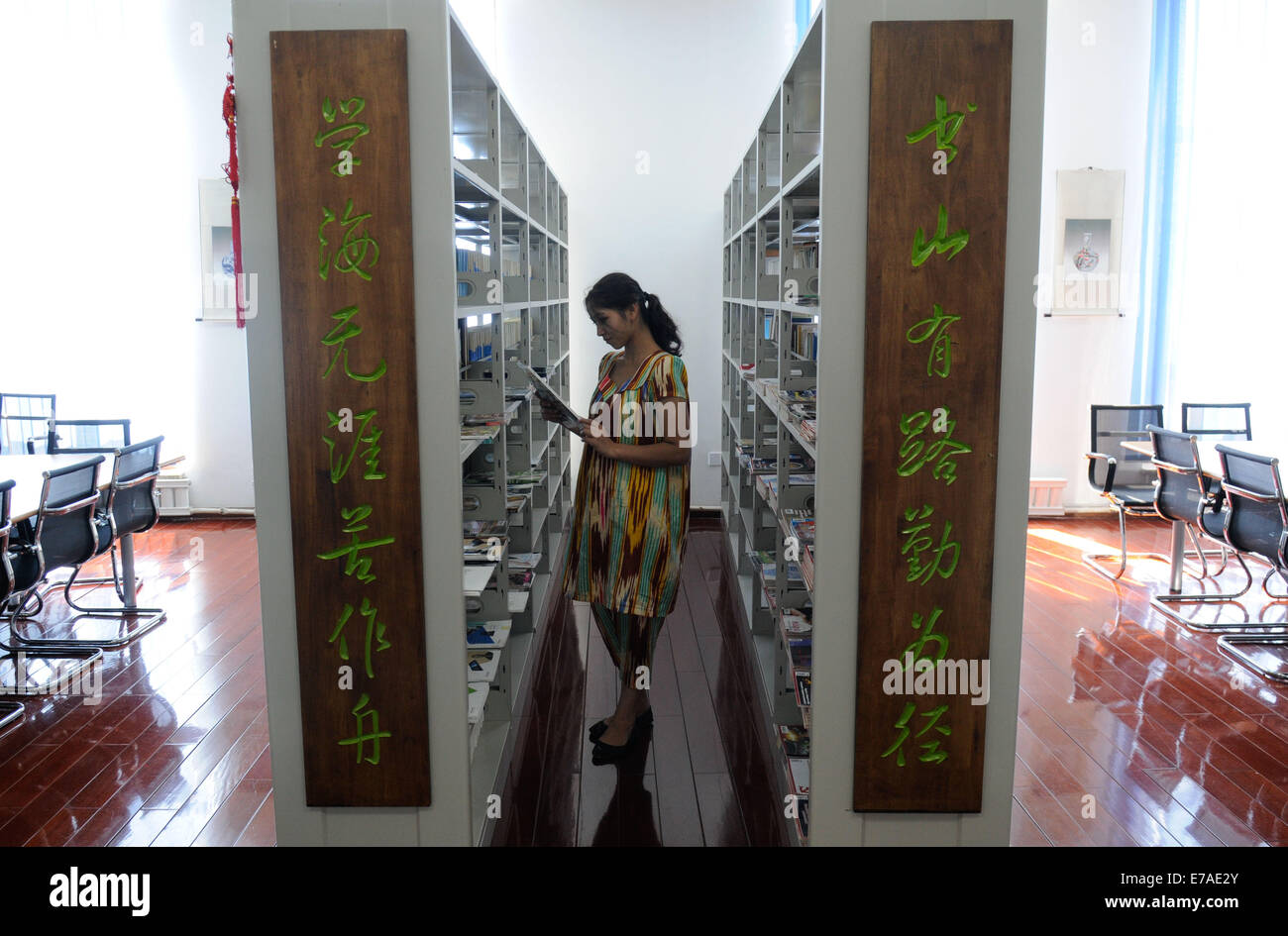 Dushanbe, Tajikistan. 11th Sep, 2014. A Tajik girl reads a book at the ...