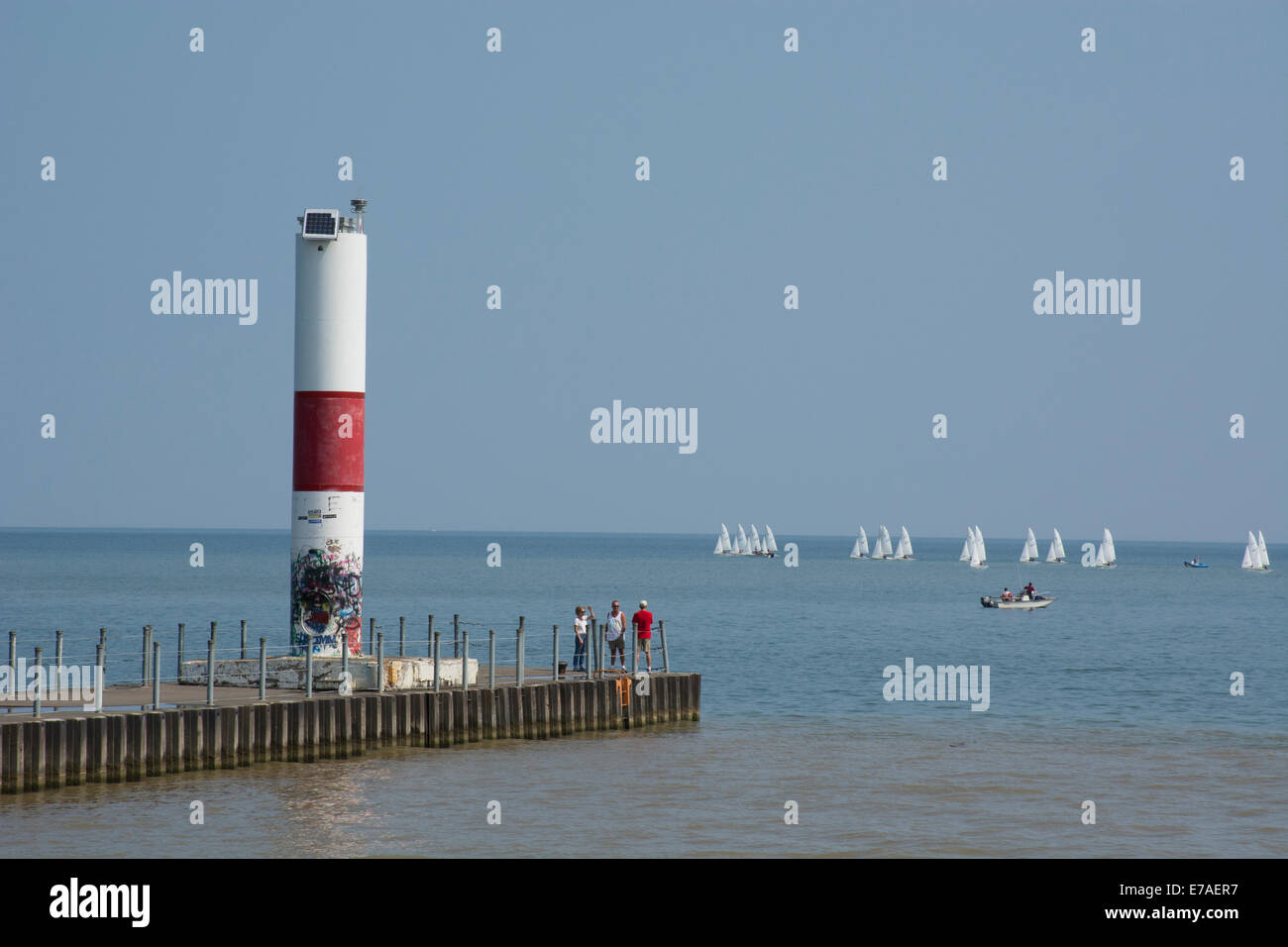New York, Rochester. Ontario Beach Pier and lighthouse, sailing school ...