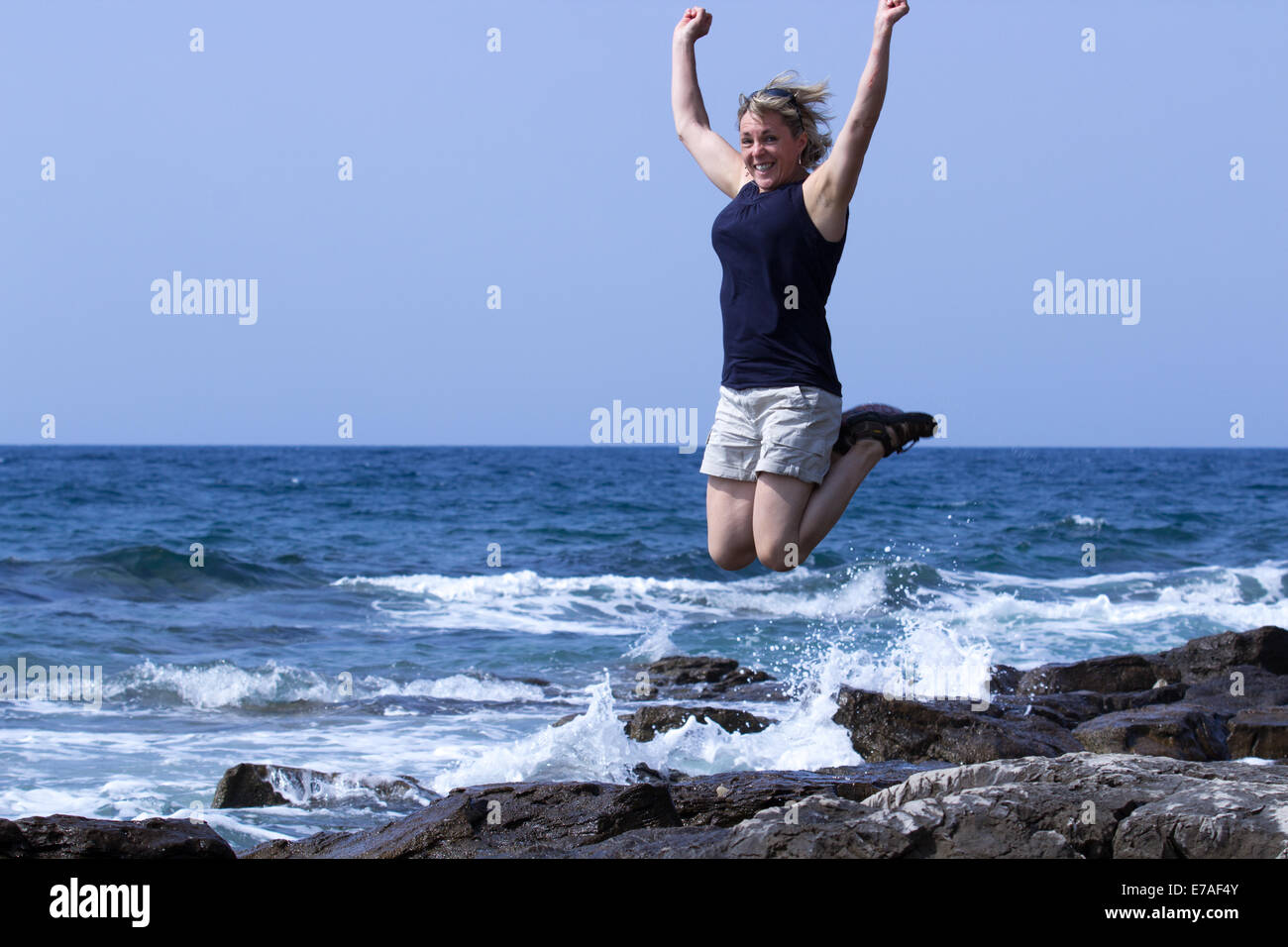 middle aged lady jumping for joy Stock Photo - Alamy
