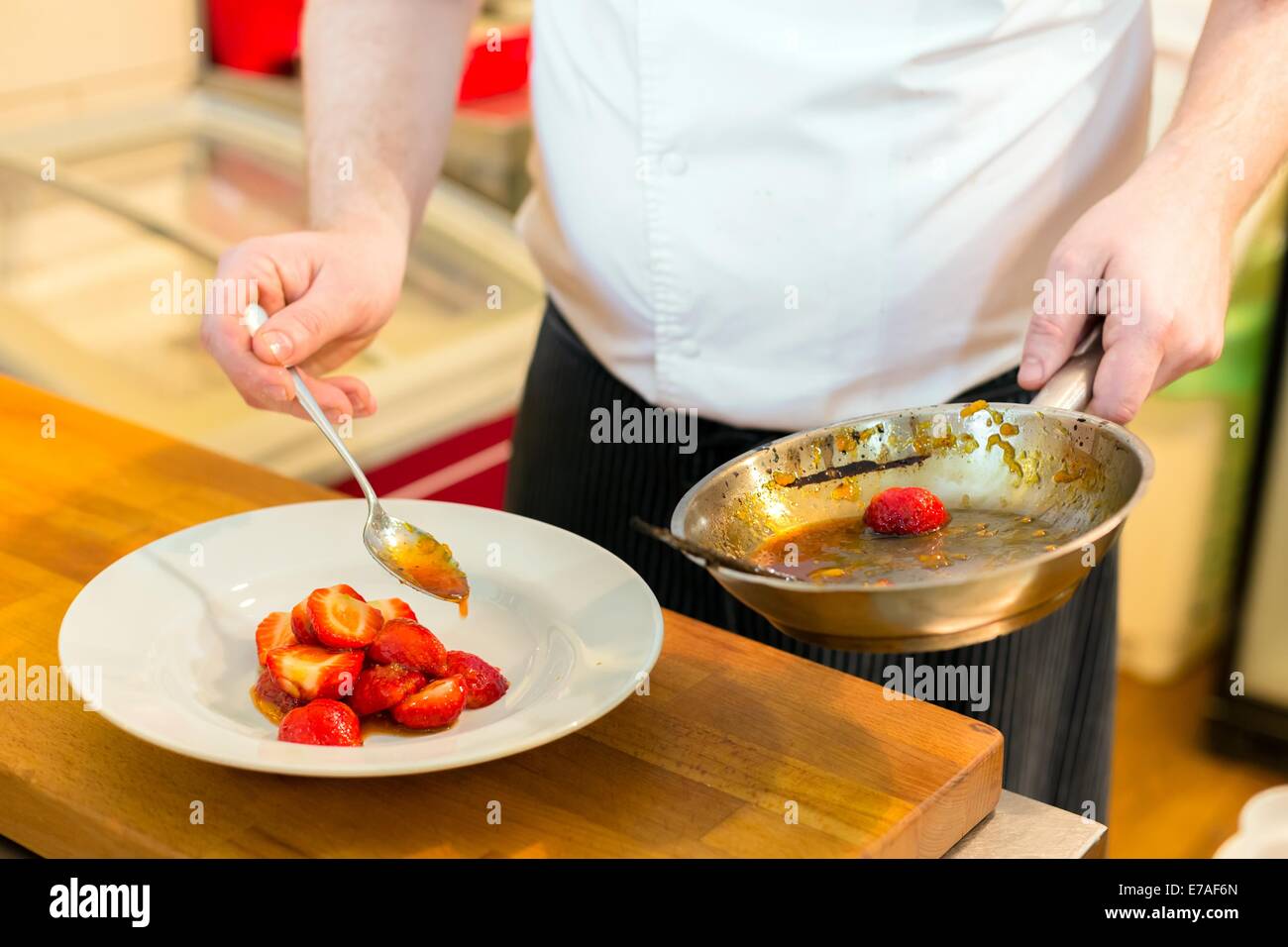 Human hands cooking fruits in kitchen Stock Photo - Alamy