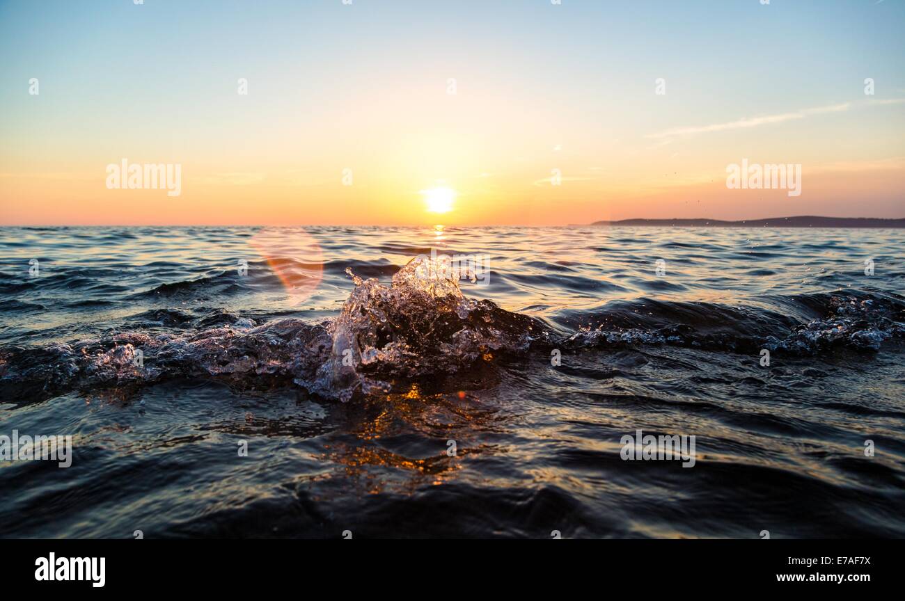 ocean wave at sunset Stock Photo - Alamy