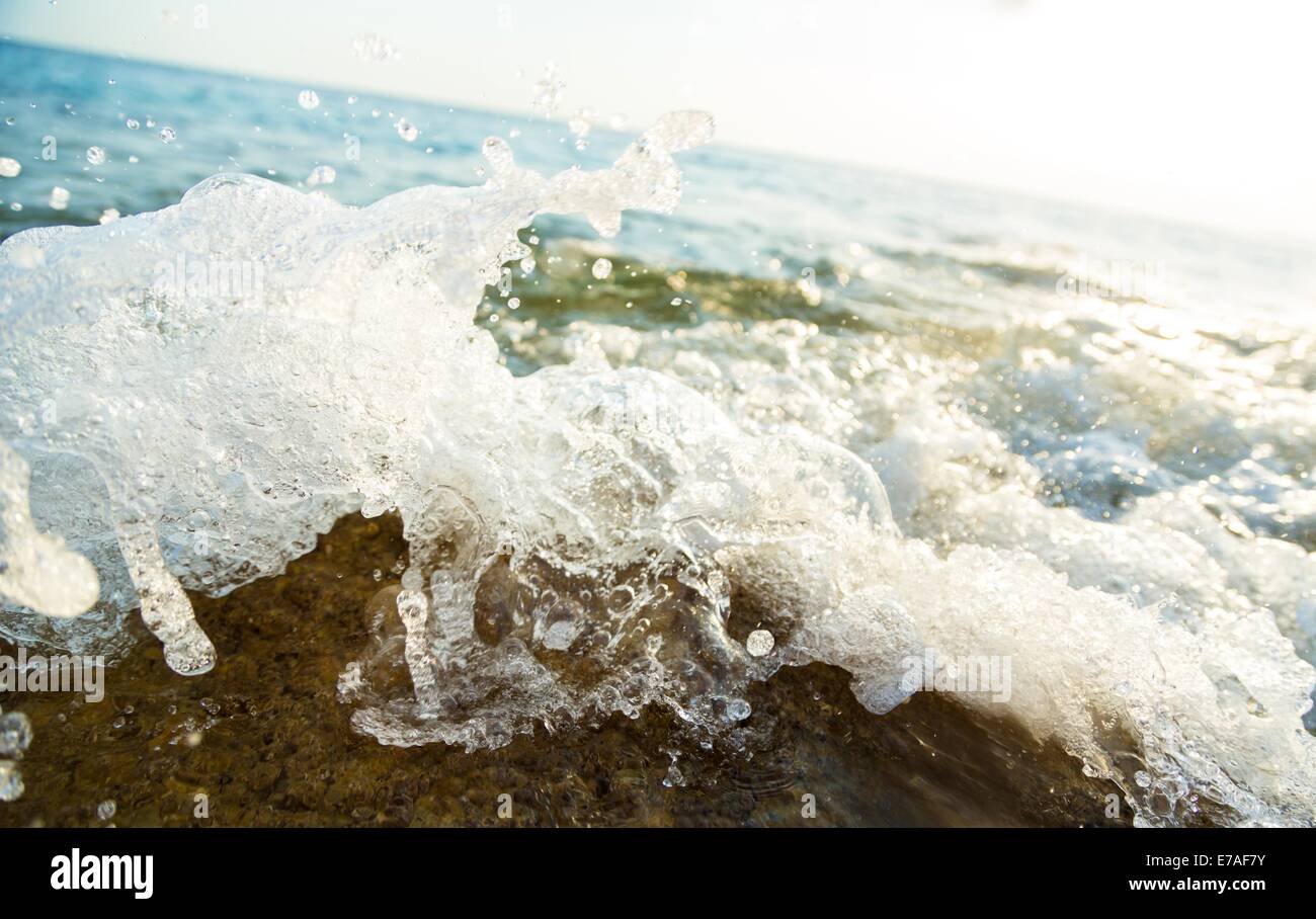 ocean wave at sunset Stock Photo - Alamy