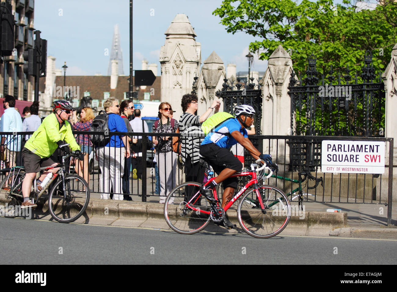Cyclists entering Parliament Square from Westminster Bridge ...