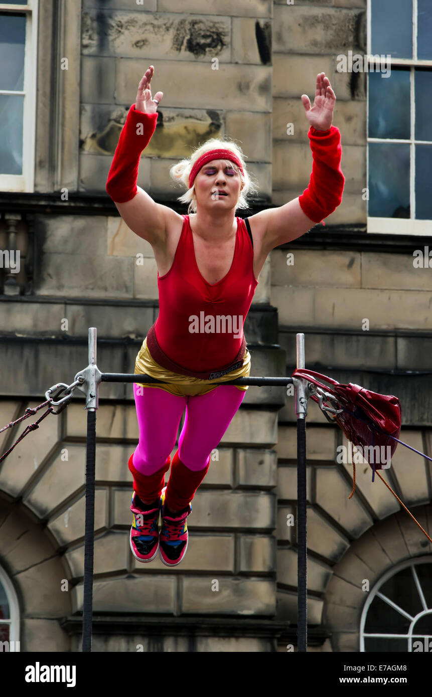 "Felicity Footloose" performing an acrobatic balancing/knife juggling ...