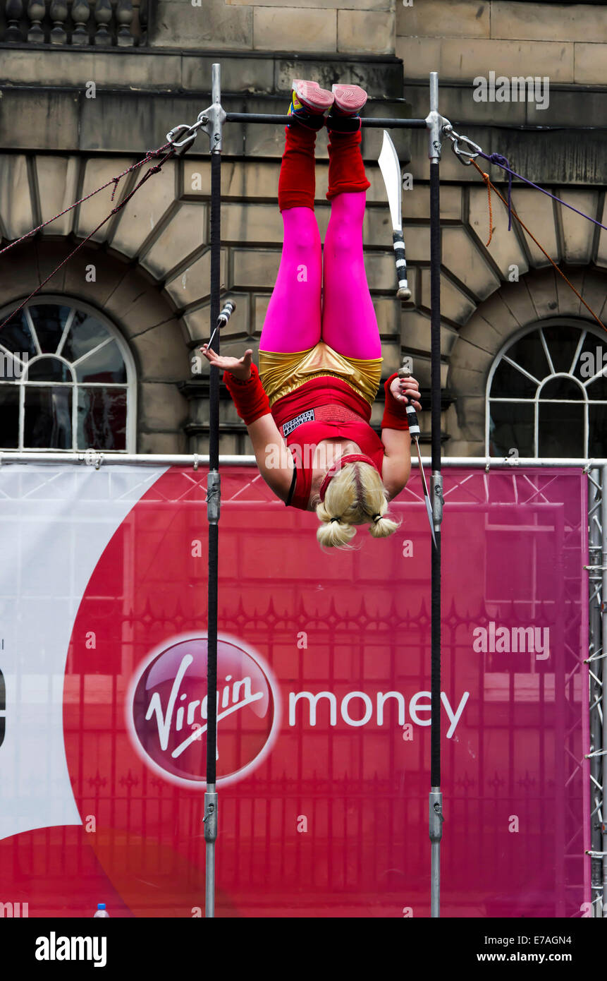 "Felicity Footloose" performing an acrobatic balancing/knife juggling ...
