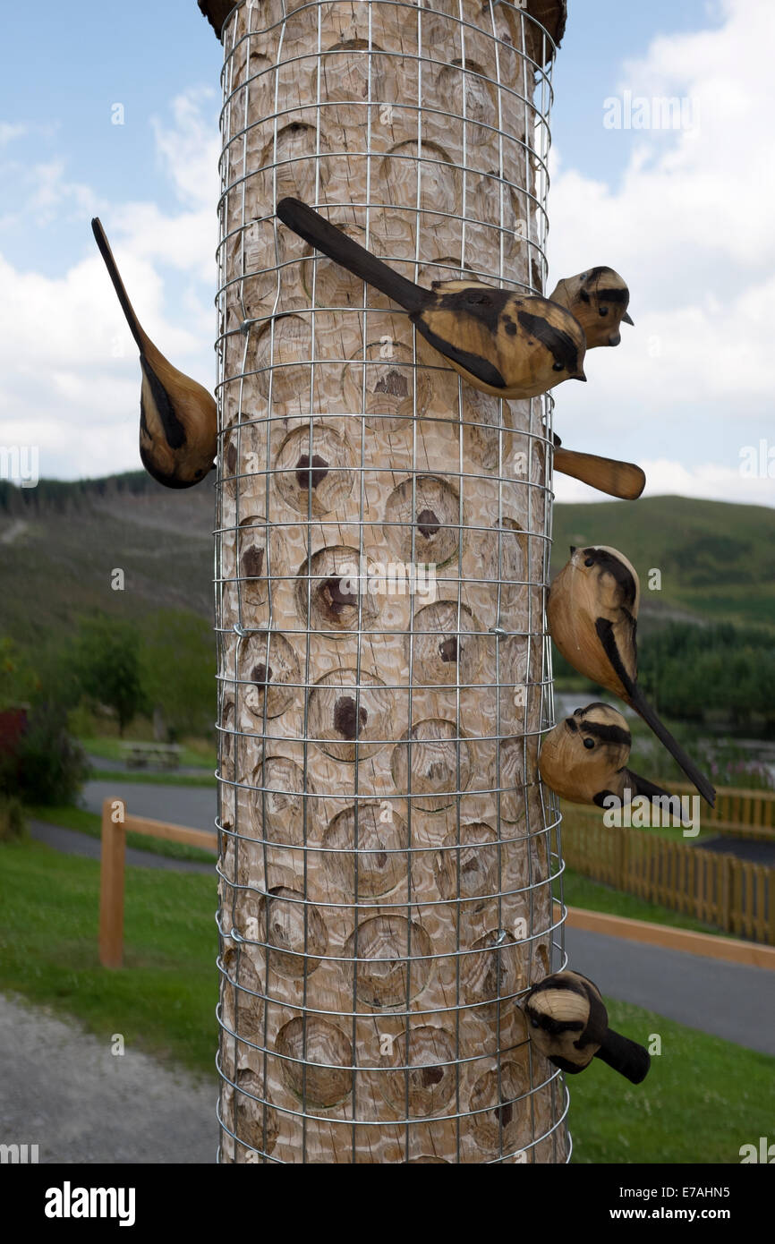 Carved Wooden Birds Feeding Tree Public Art Wood Stock Photo - Alamy