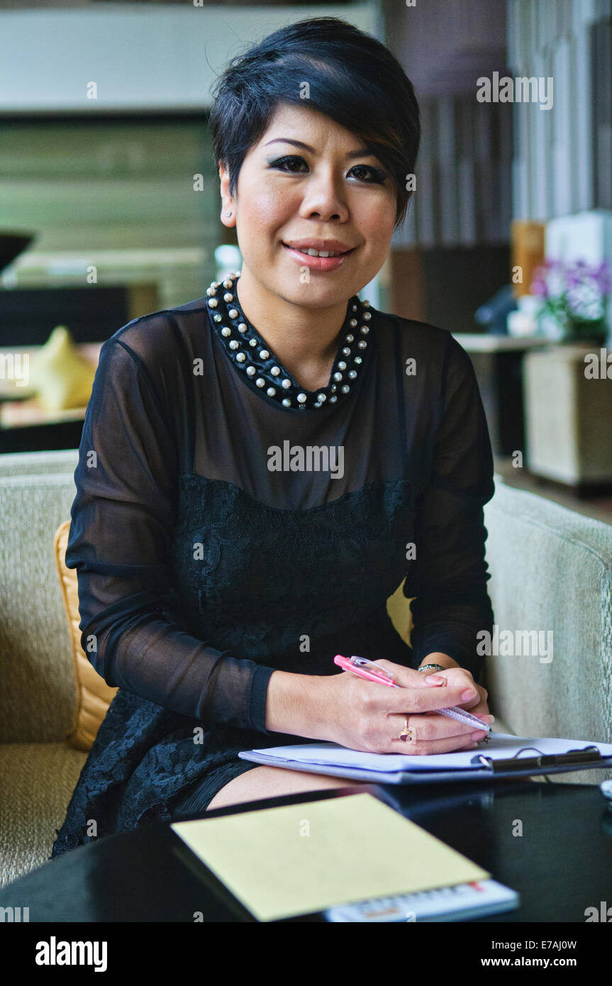 Business woman smiling Stock Photo - Alamy