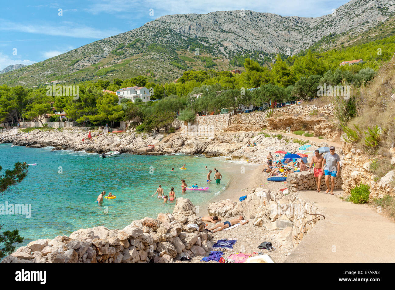 Tourists on a beach near Paklina campsite in Ivan Dolac village, Hvar ...
