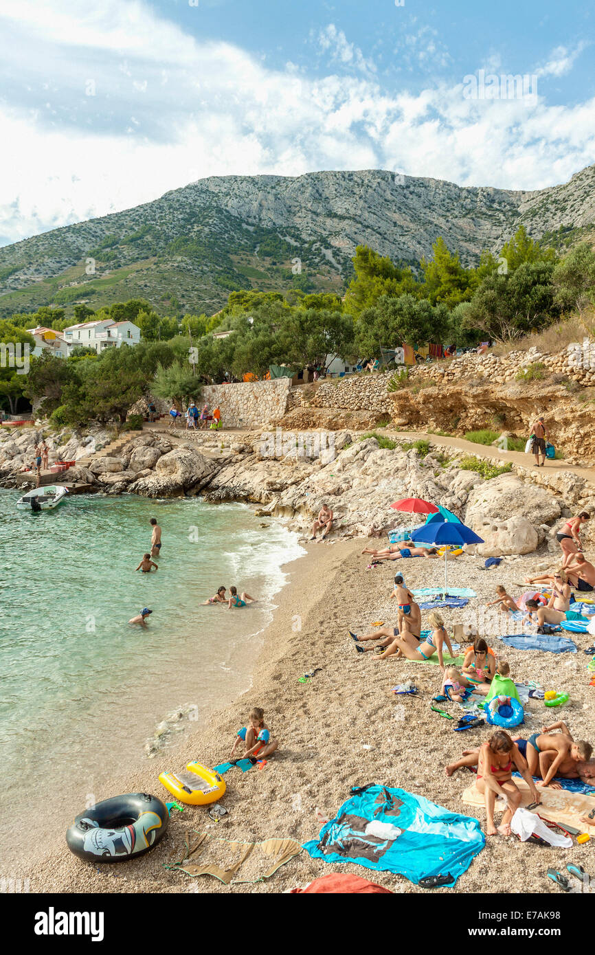 Tourists on a beach near Paklina campsite in Ivan Dolac village, Hvar ...