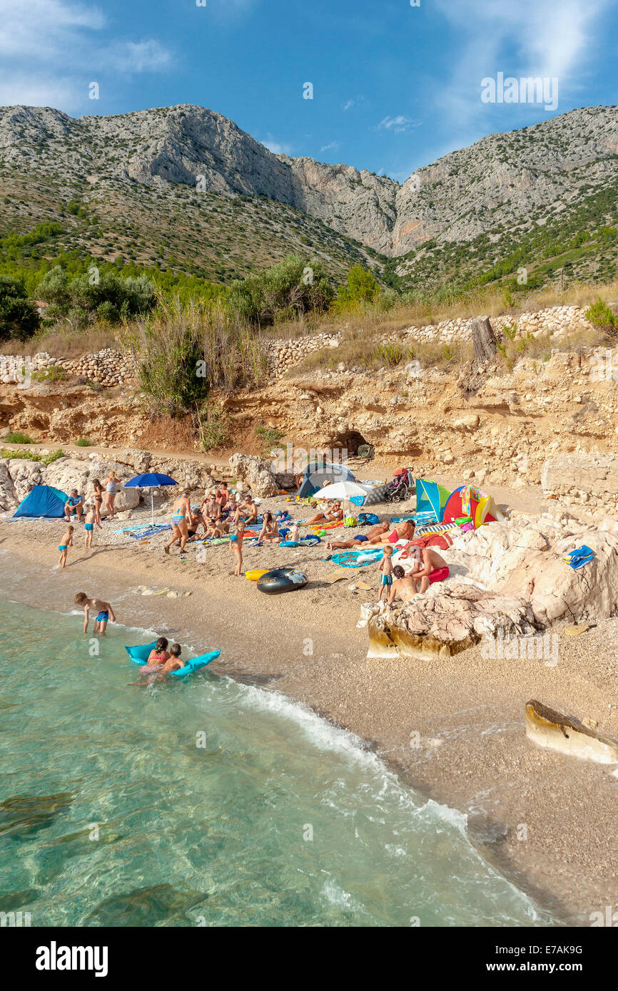 Tourists on a beach near Paklina campsite in Ivan Dolac village, Hvar ...
