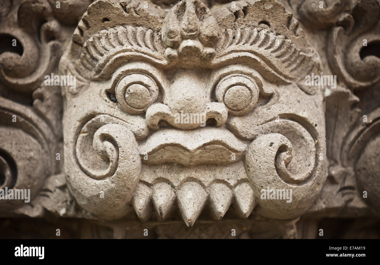 Face of the ancient deities carved in stone. Indonesia, Bali island ...