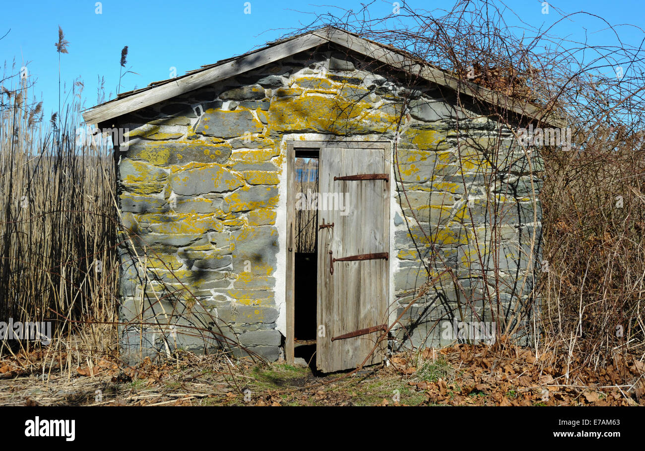 Stone Ice House with open door viewing pond Stock Photo - Alamy
