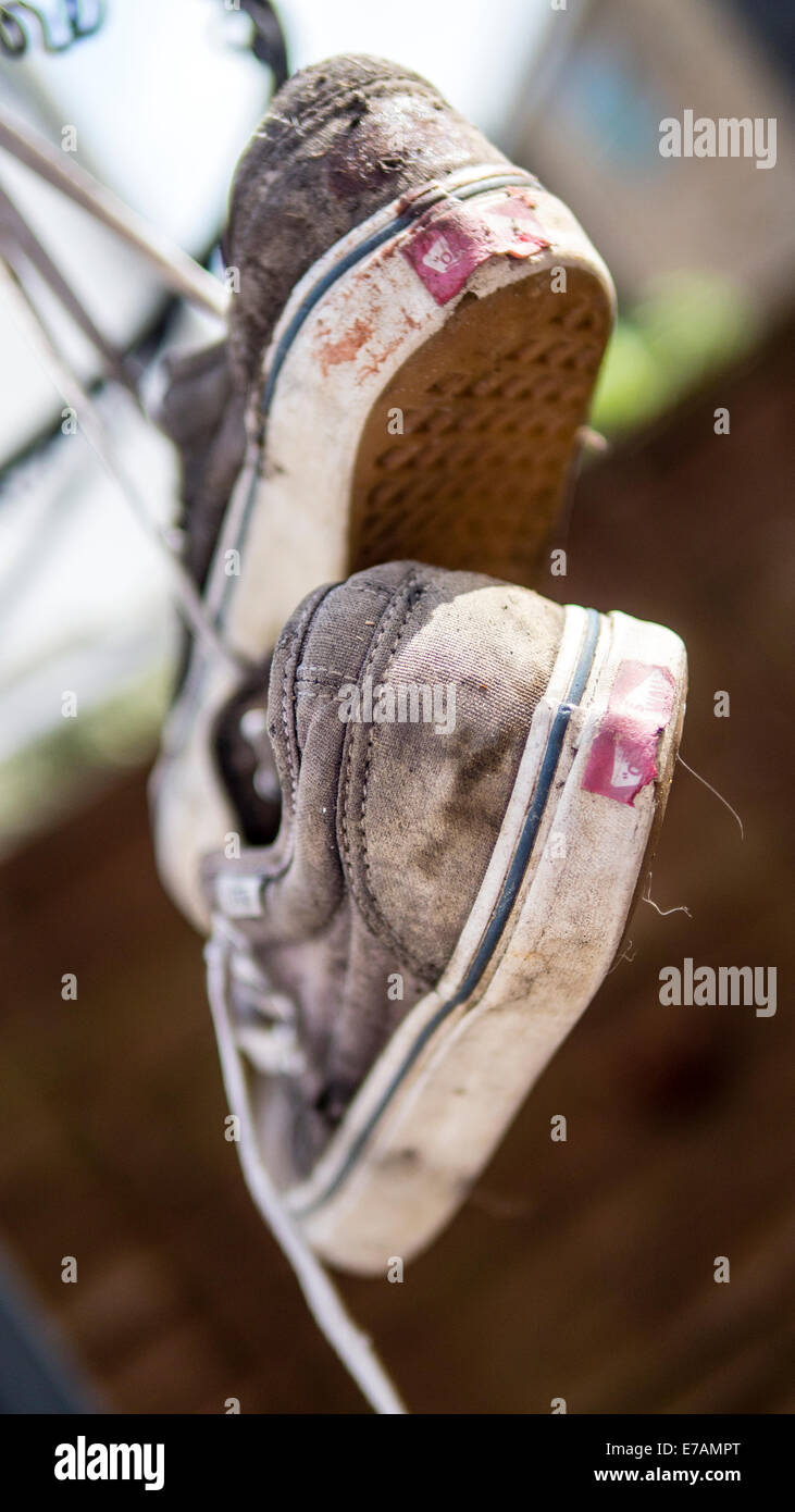 Pair of Old Trainers Hanging from Power Lines, Shoe Tossing Stock Photo ...