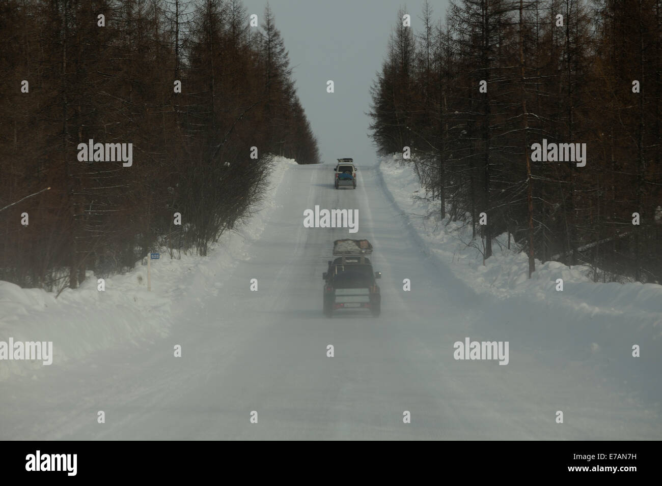 4wd expedition snow mountains ice road forest Stock Photo - Alamy