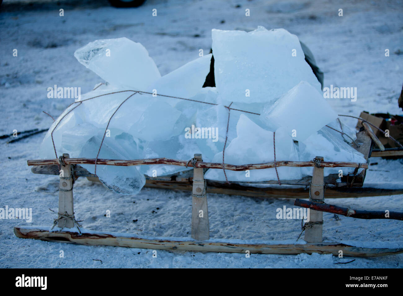 wooden sledge with ice blocks in snow Stock Photo - Alamy
