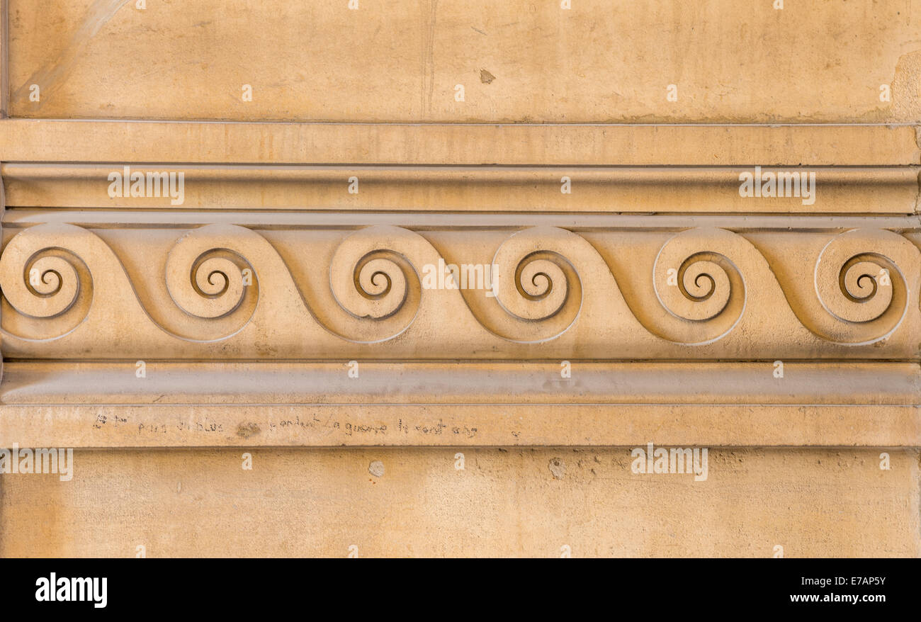 A close of a wave carved in stone provides an architectural detail on a ...