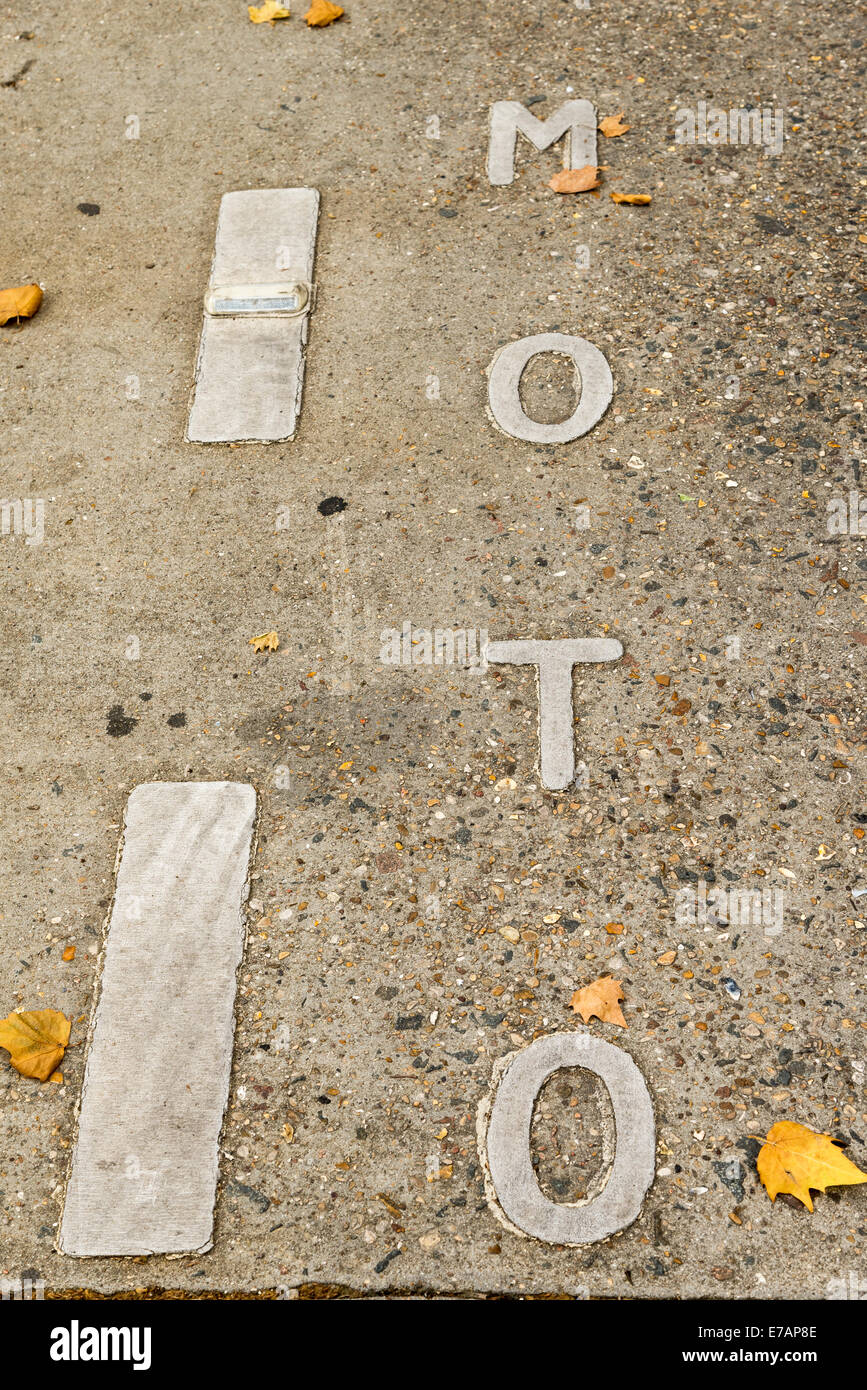The word moto is painted on a road signifying a parking spot Stock ...