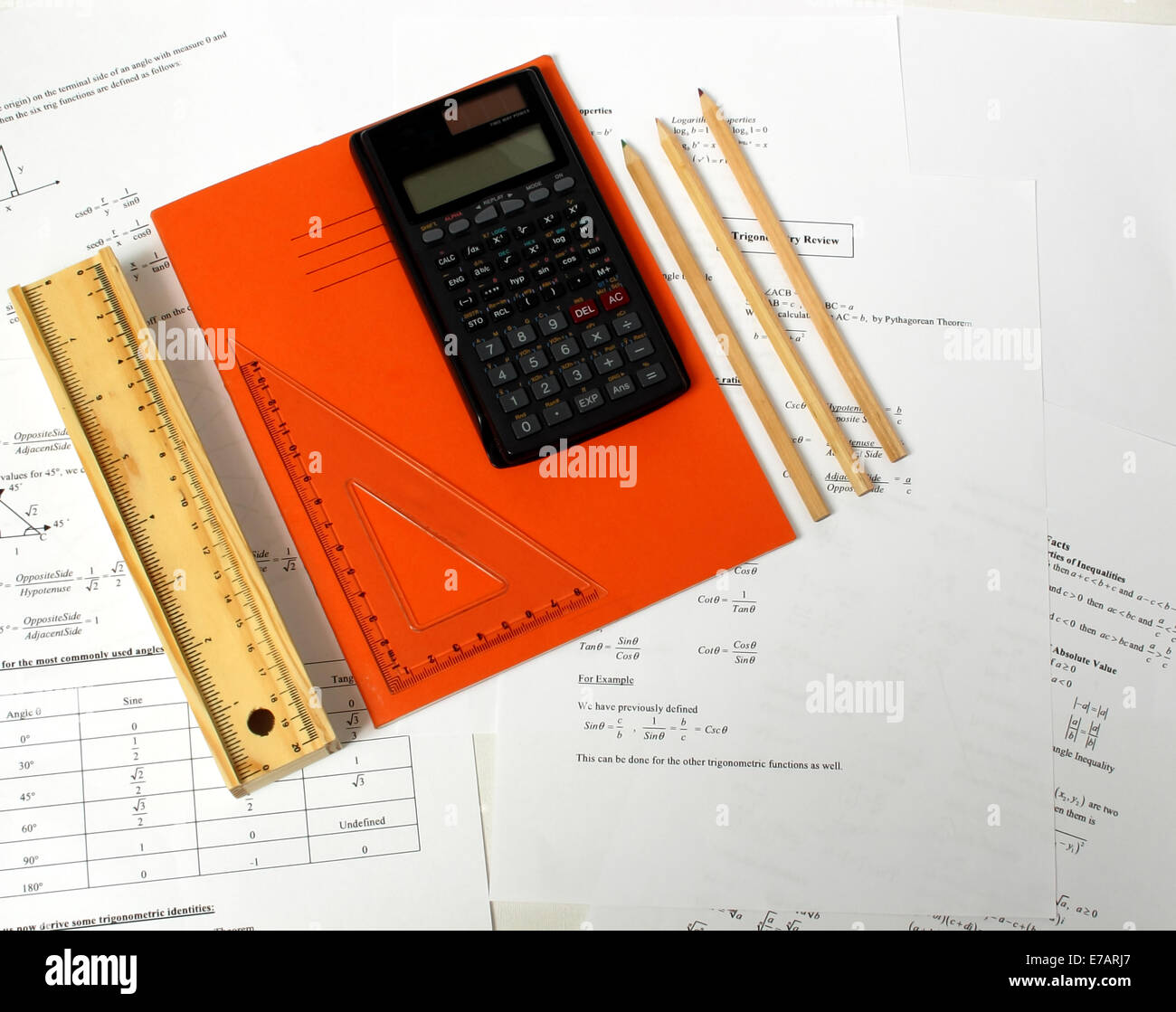 An image showing a calculator, a book and a pencil case with some ...