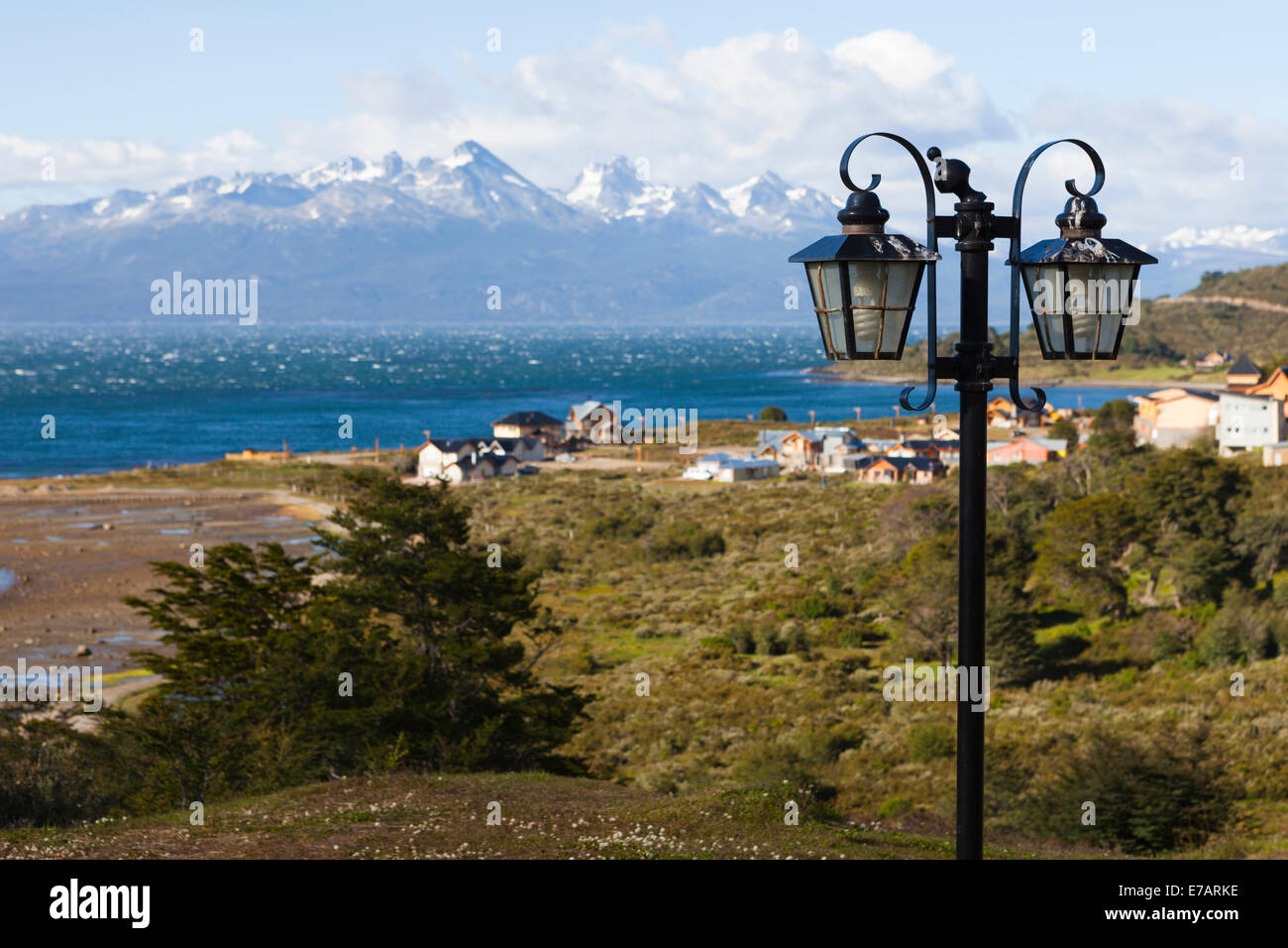 Lamp post against a coastal landscape, Ushuaia, Tierra del Fuego ...