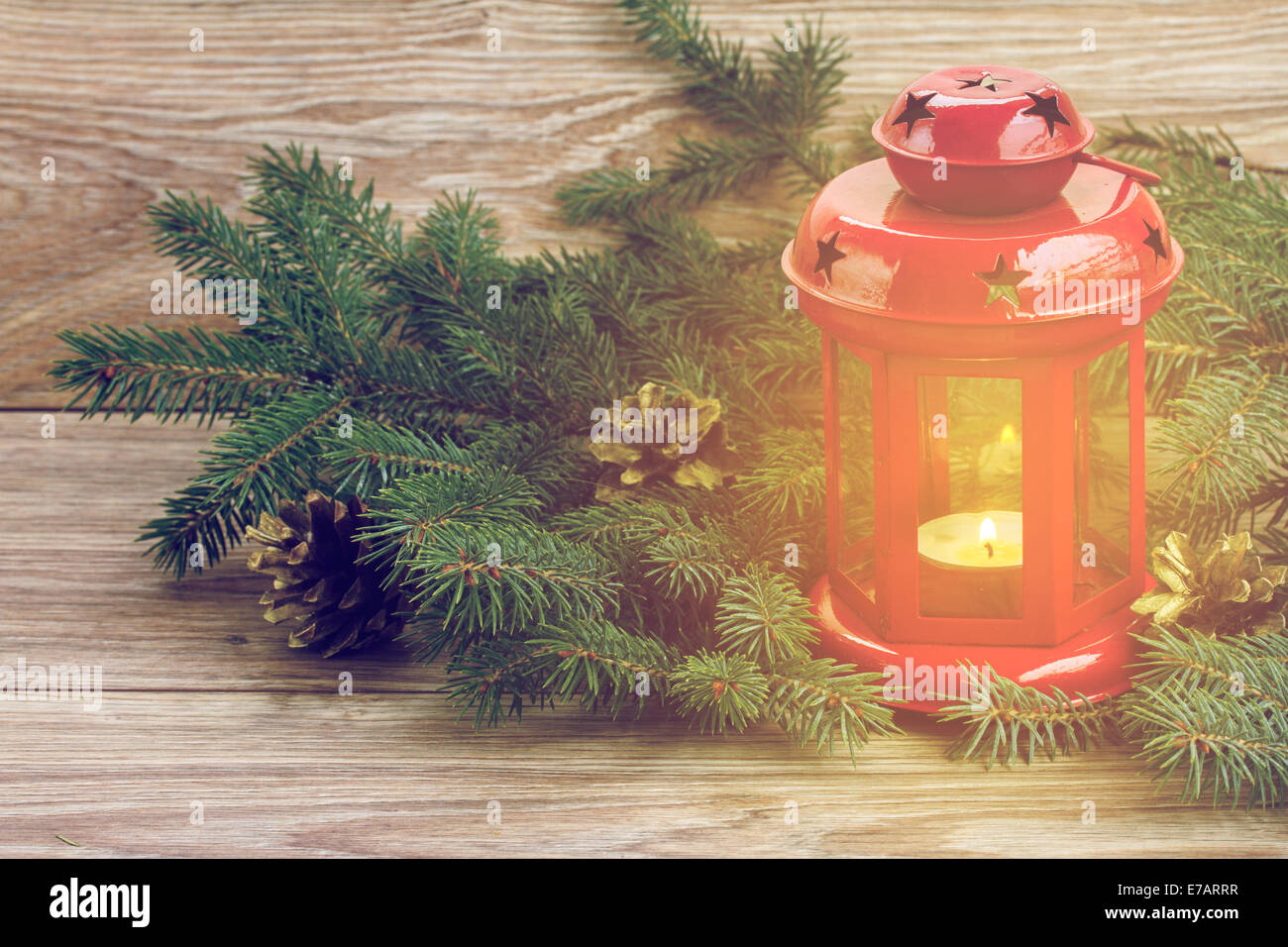 red glowing lantern with evergreen tree Stock Photo - Alamy