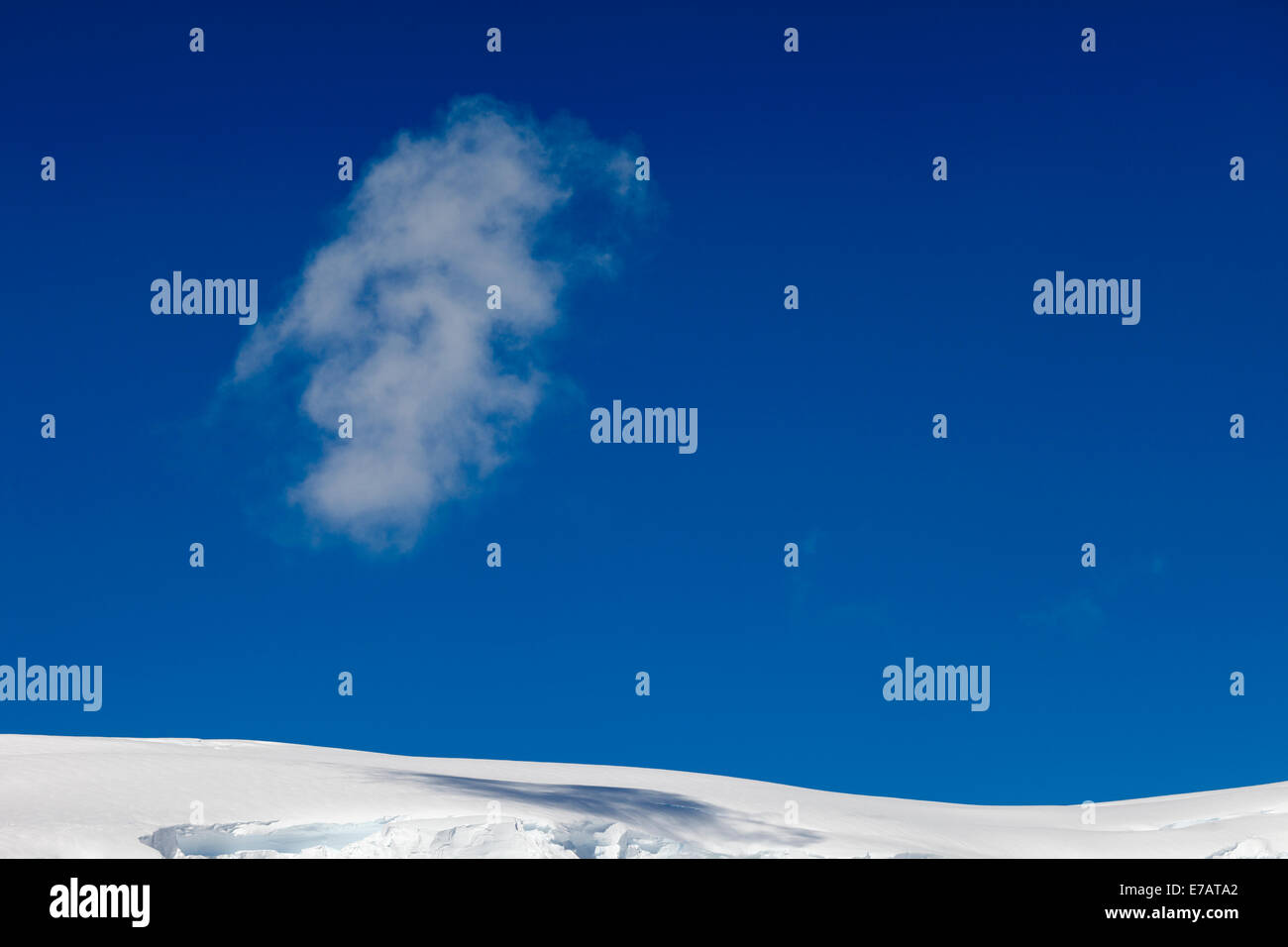 Snowy mountaintop and lonely cloud at the Gullet, Antarctica Stock ...