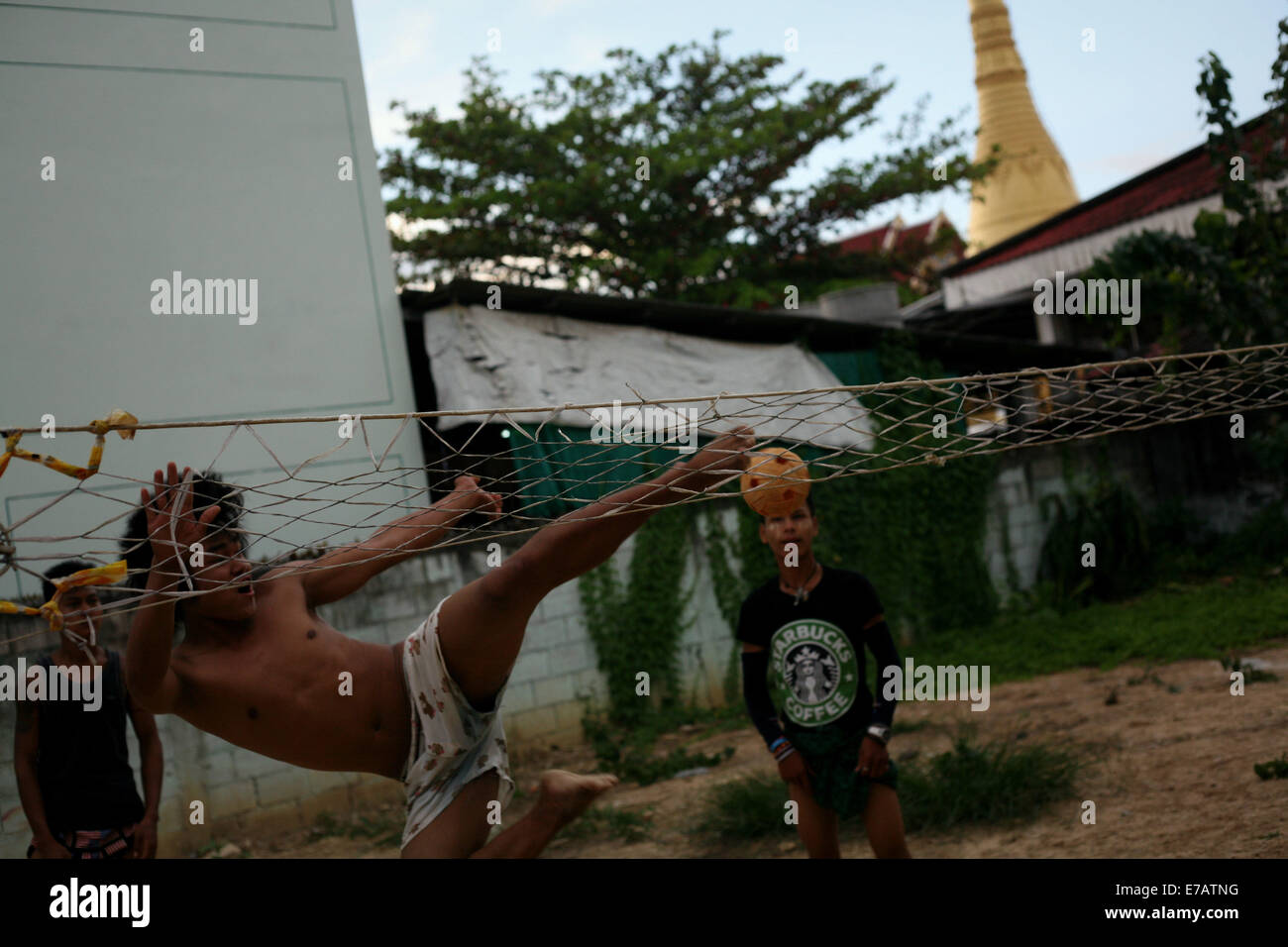 Mae Sot, Thailand. 11th Sep, 2014. Burmese migrant workers, playing ...