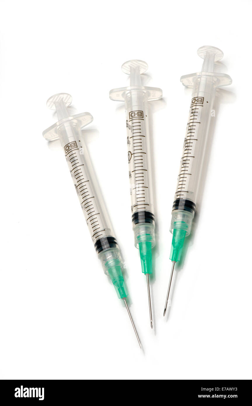 Medical syringes on white Stock Photo - Alamy