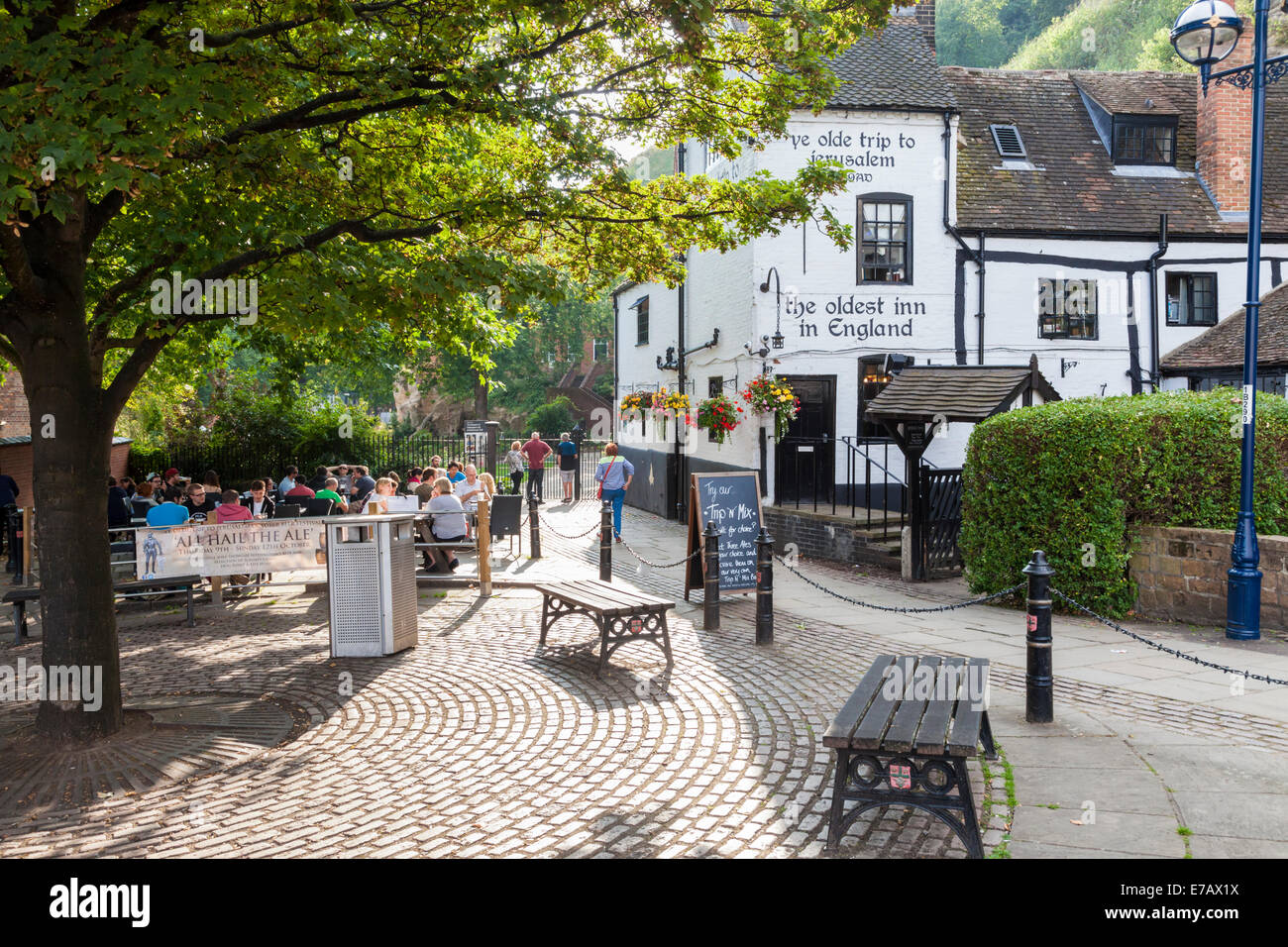 People drinking at Ye Olde Trip to Jerusalem, a famous pub that claims ...