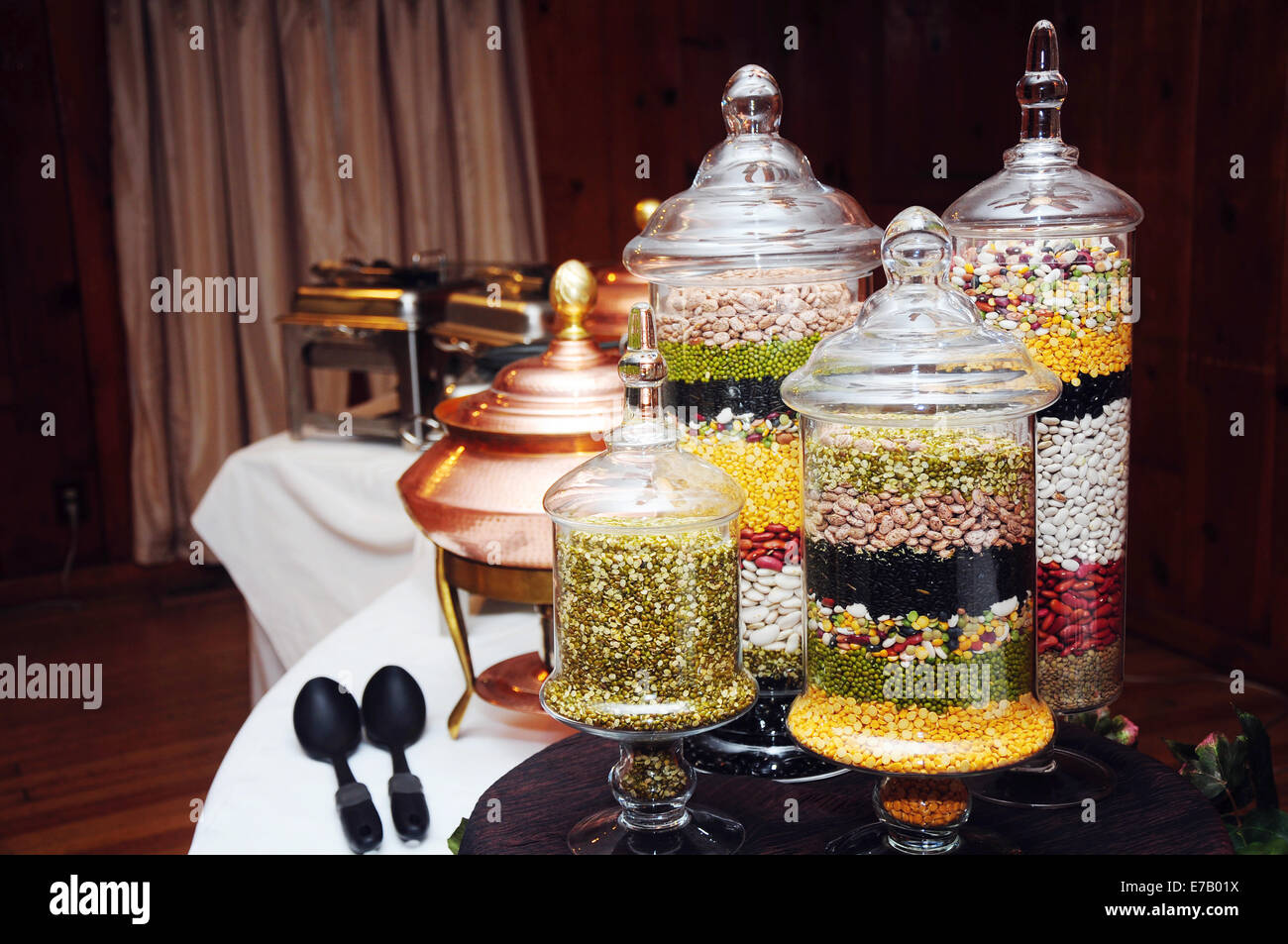 A buffet set up at a wedding reception, bright beans in fancy giant ...