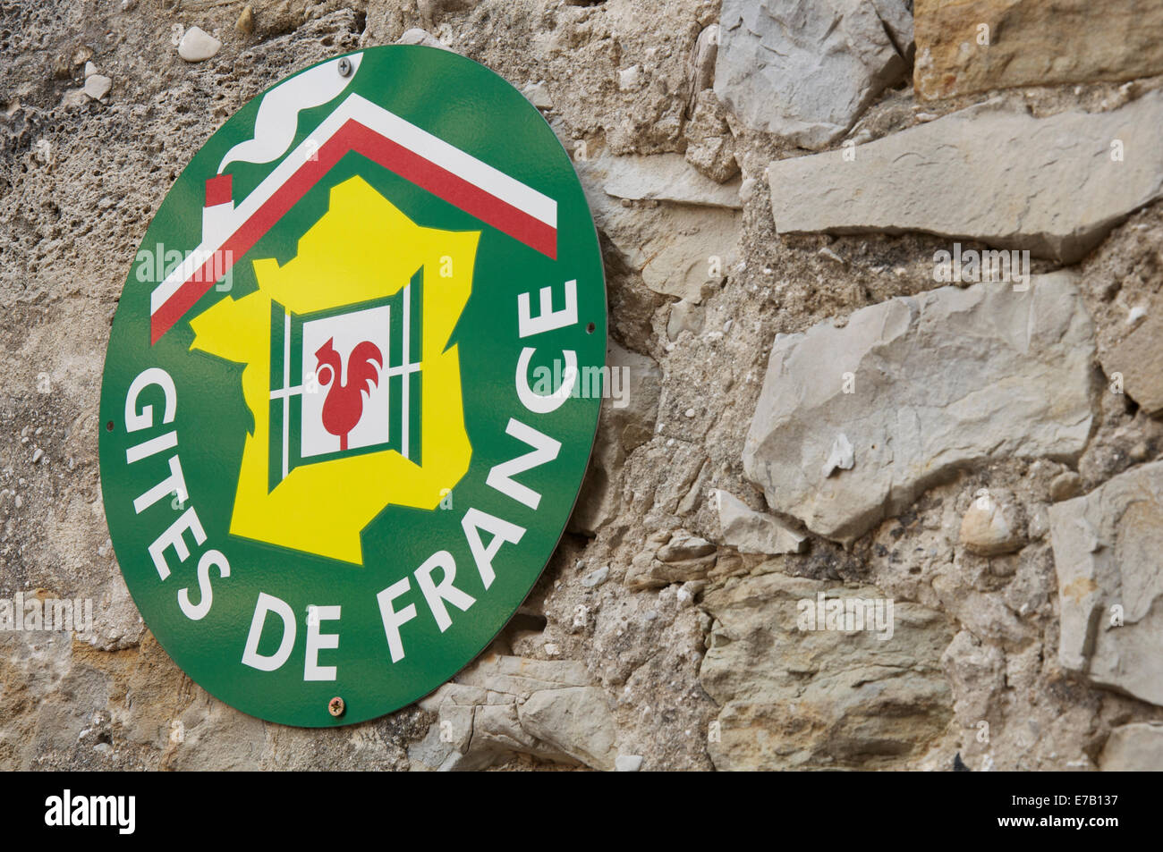 French rural Tourism. Gîtes de France sign fixed to the rough stone ...