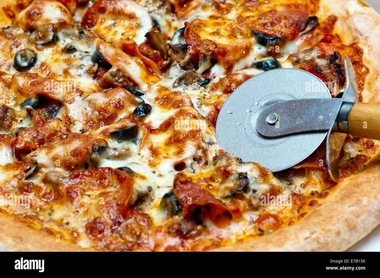 Pizza slicer hi-res stock photography and images - Alamy