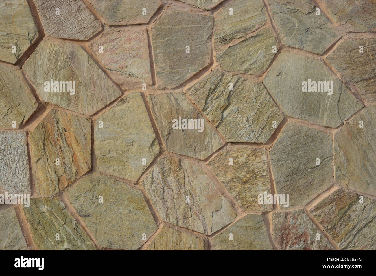 Wall covered with polygonal tiles as background Stock Photo - Alamy