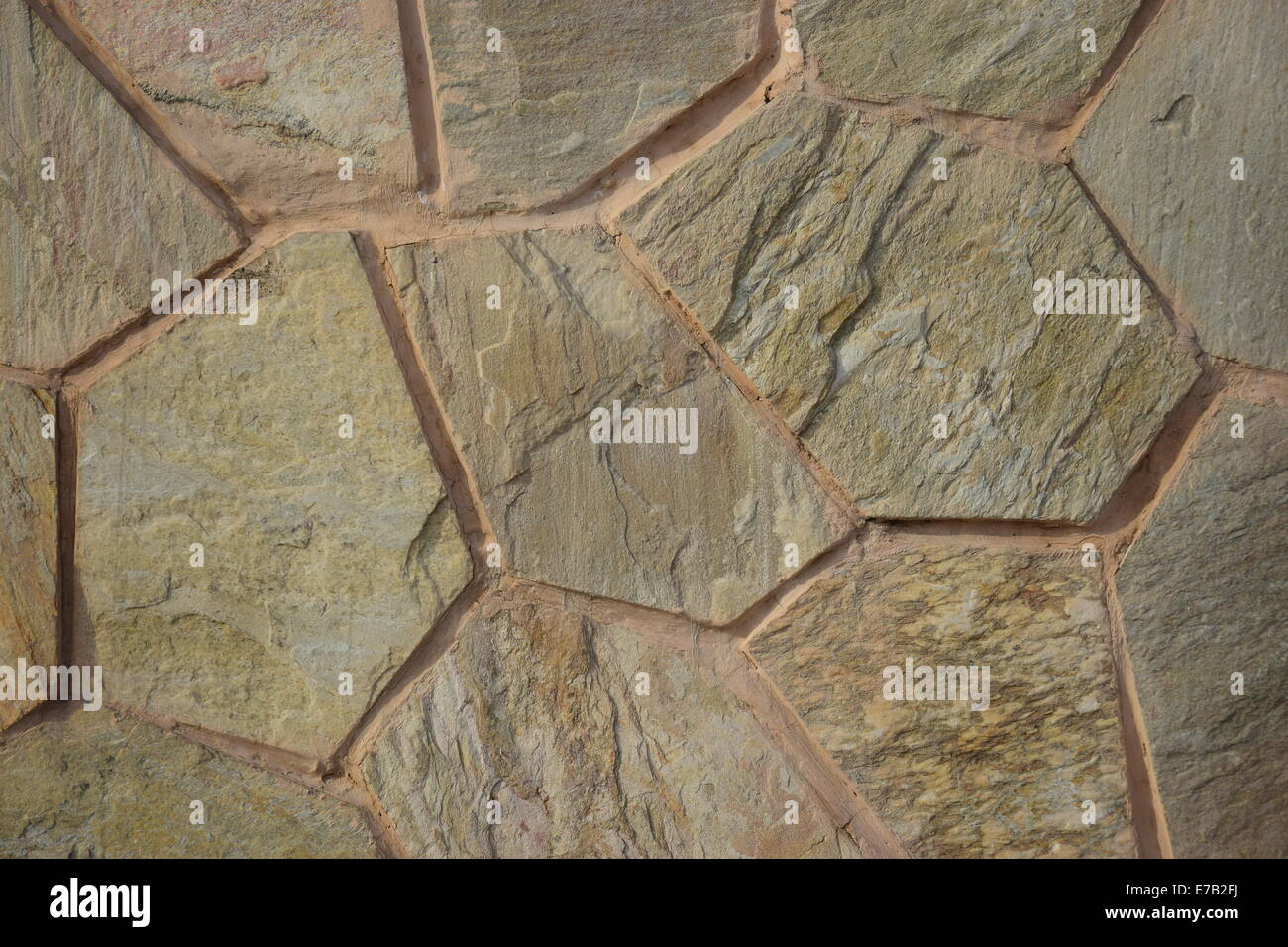 Wall covered with polygonal tiles as background Stock Photo - Alamy