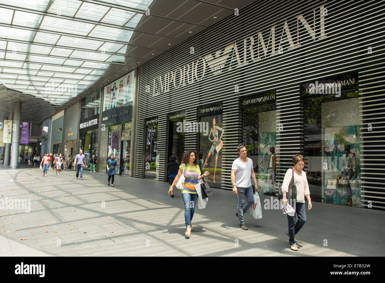Pedestrians walk past an Emporio Armani store, operated by Giorgio ...