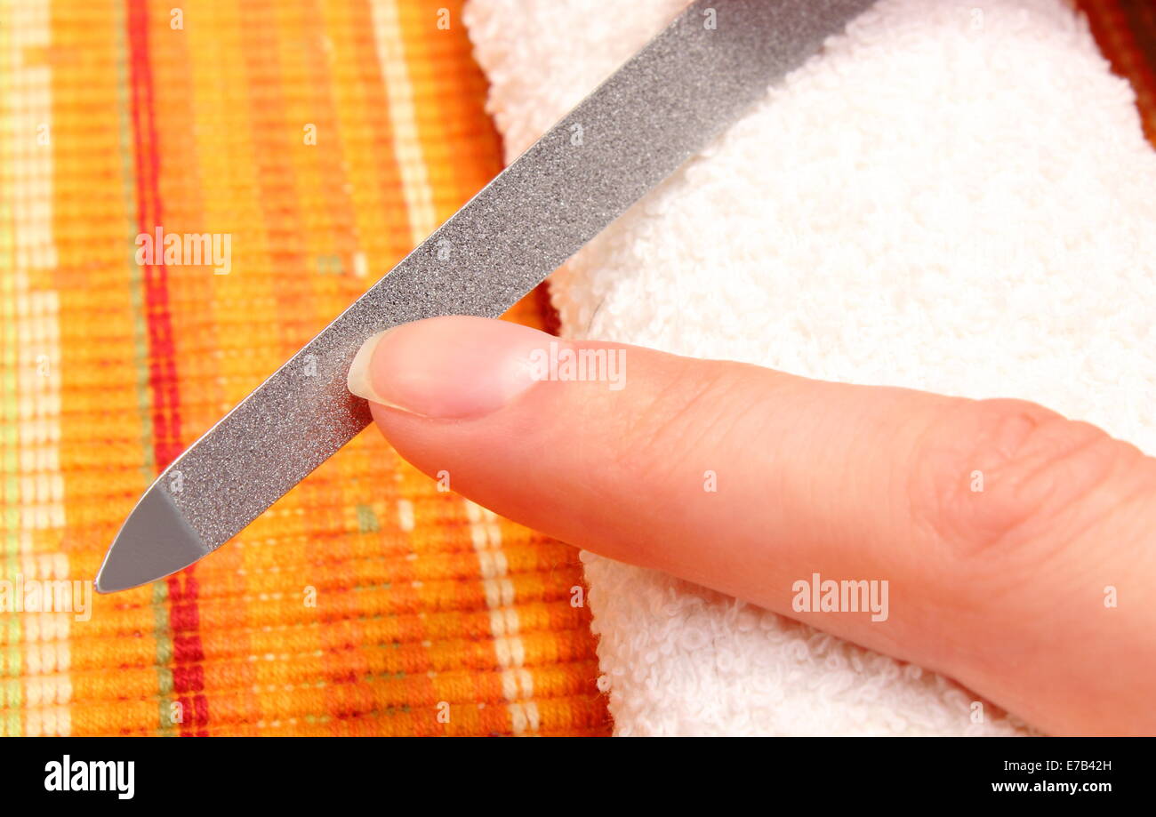 Woman polishing nails hi-res stock photography and images - Alamy