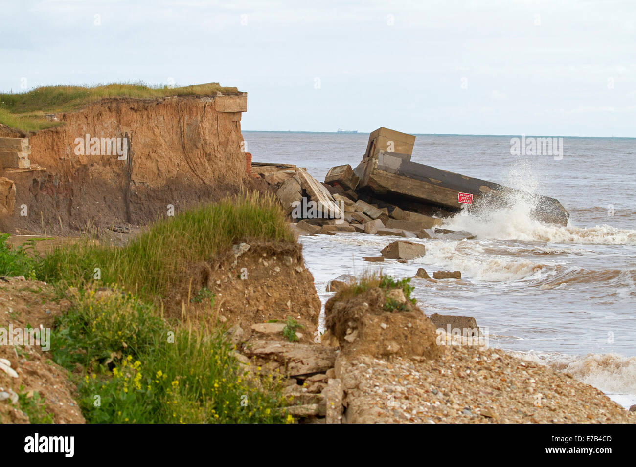 Aftermath of storm showing severe coastal erosion and concrete slabs of ...