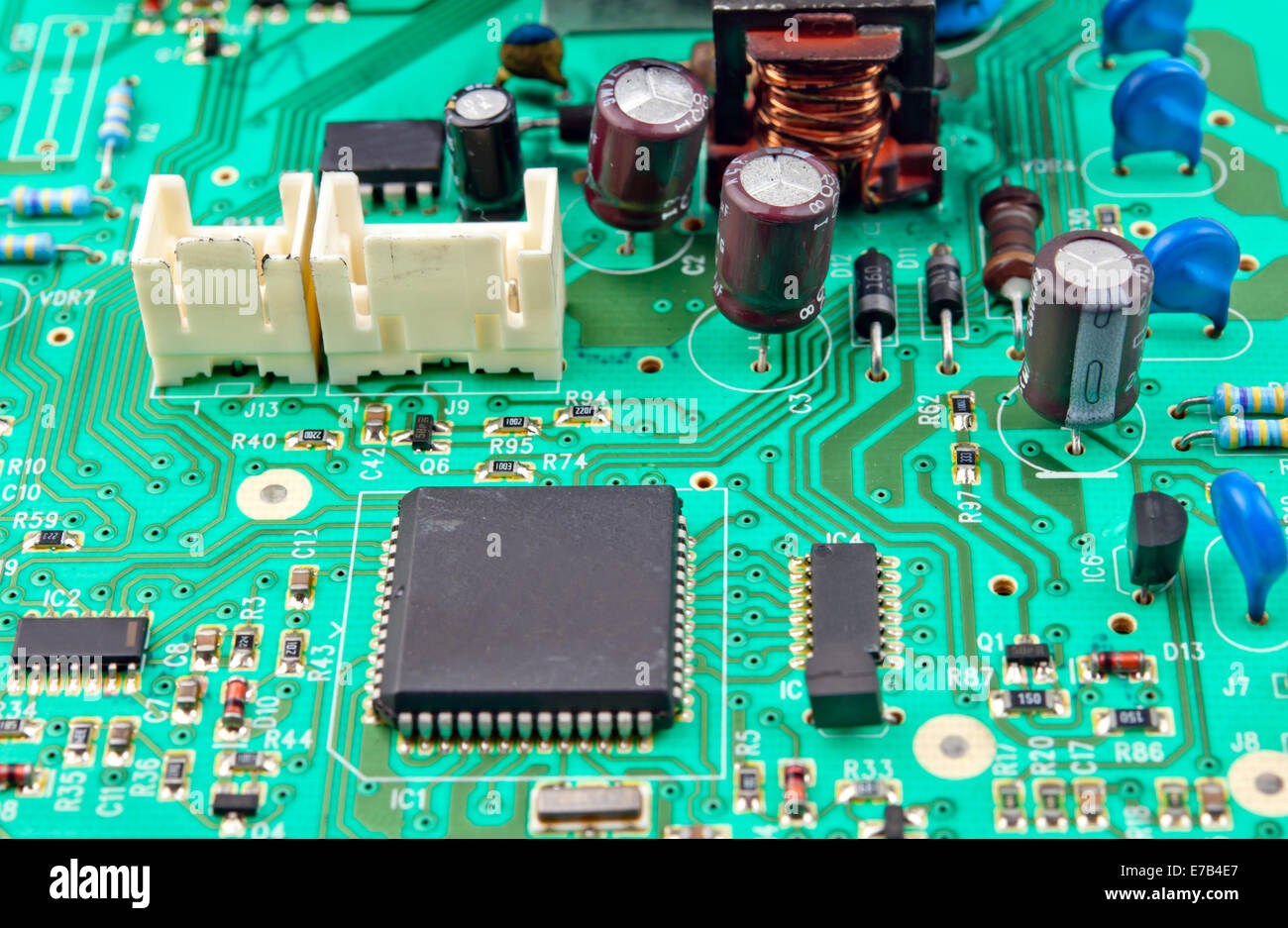 green electrical circuit board with conductors and transistors Stock ...