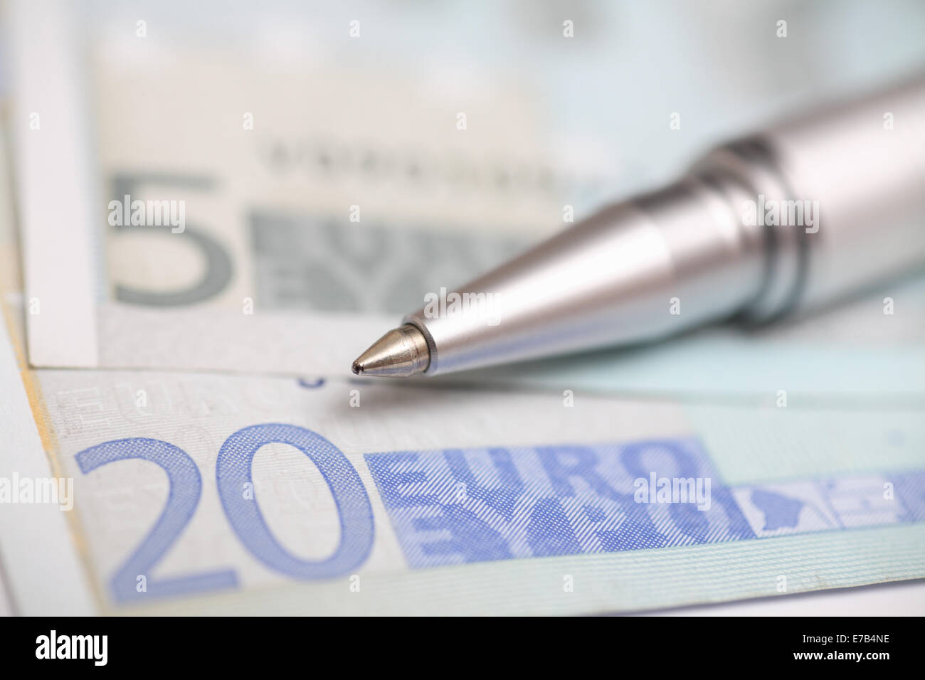 Ballpoint pen on Euro banknote background Stock Photo - Alamy