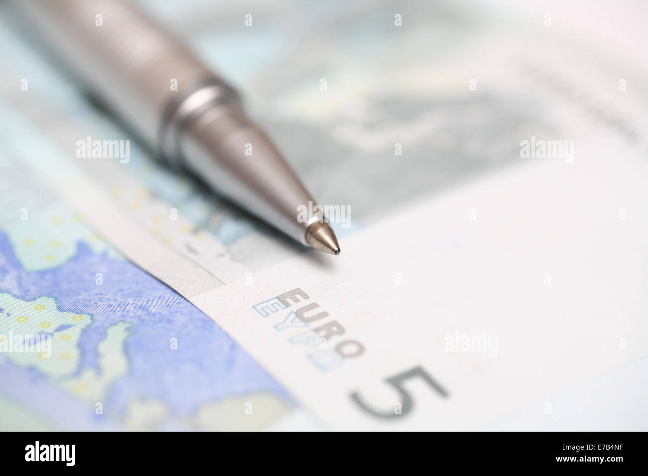 Ballpoint pen on Euro banknote background Stock Photo - Alamy